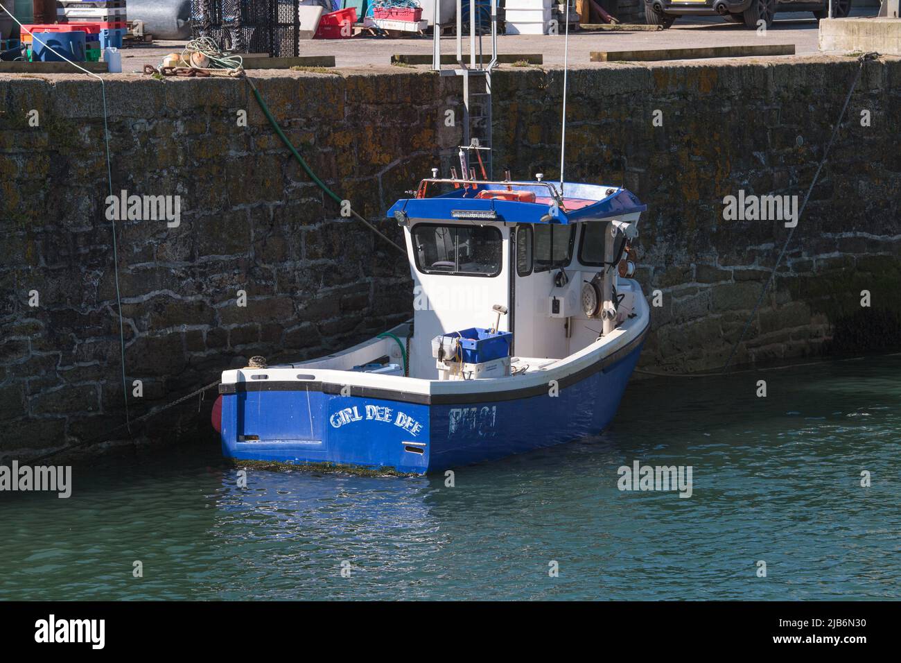Fishing boats and other small craft in the Cornish fishing harbour of ...