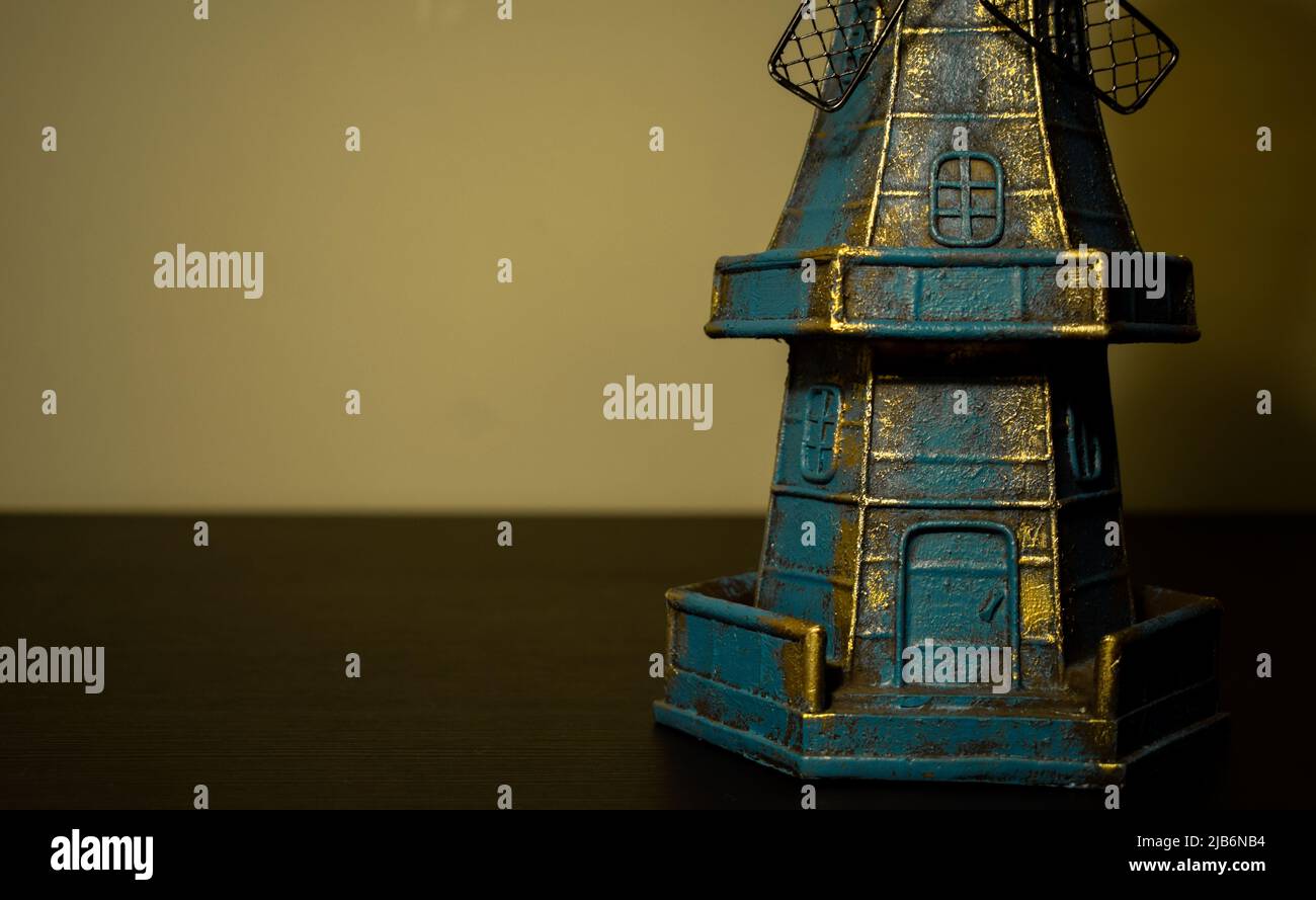 Rusty lighthouse model on a table for background Stock Photo - Alamy