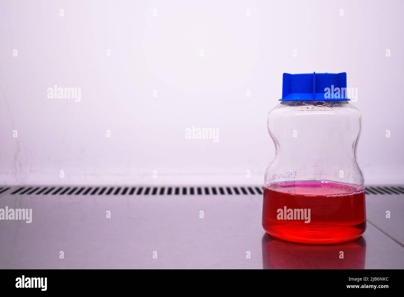 Cell medium bottle in a hepa filter cabin at the cell culture ...