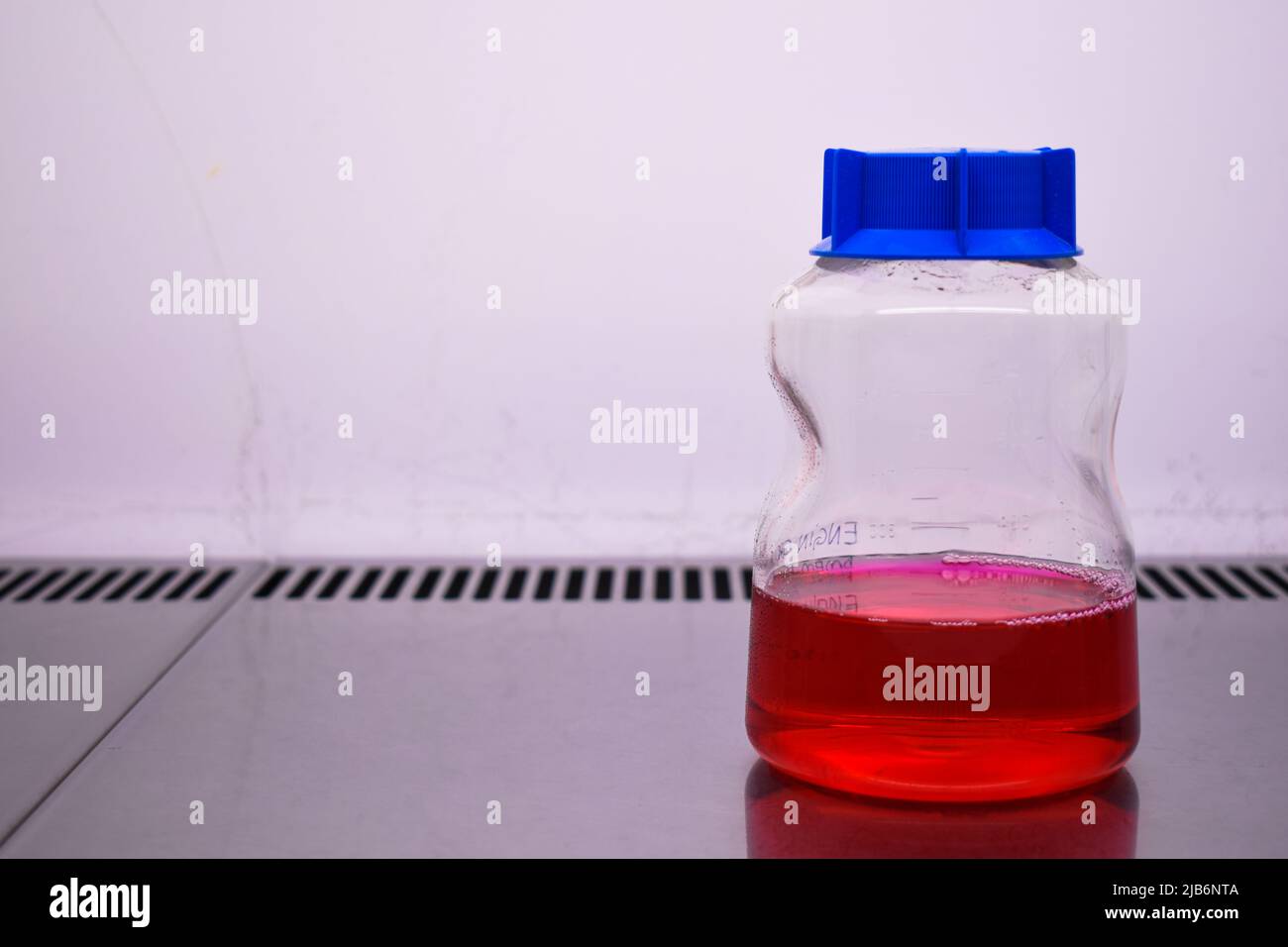 Cell medium bottle in a hepa filter cabin at the cell culture ...