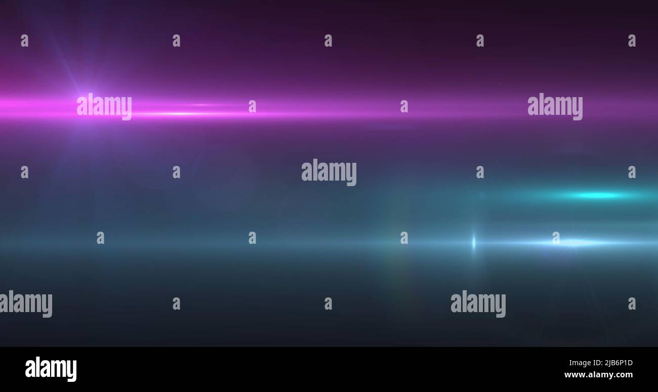 Image of pink spotlight with lens flare and light beams moving over ...