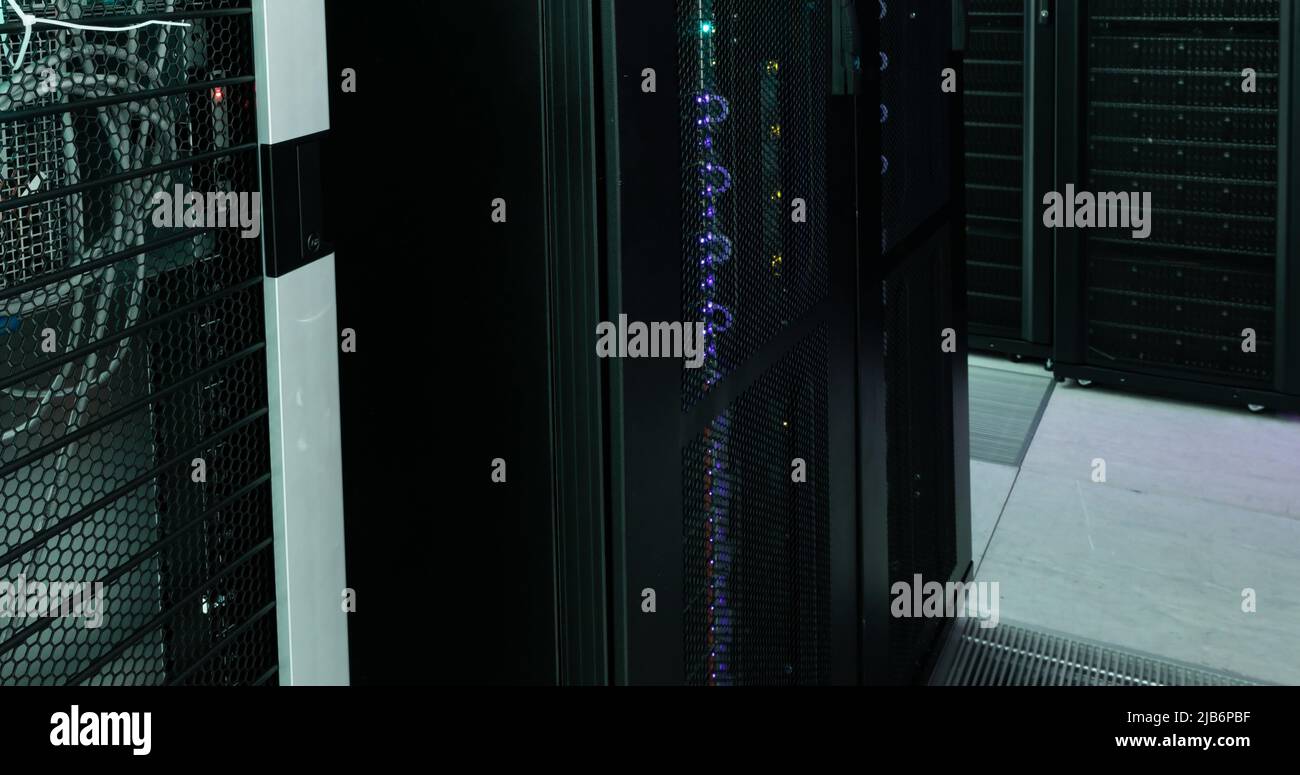 Image of empty corridor with rows of computer servers with green and ...