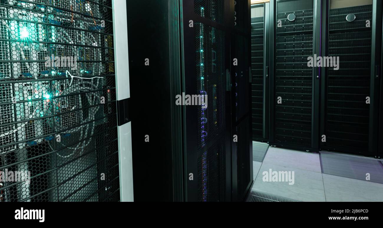Image of empty corridor with rows of computer servers with green and ...