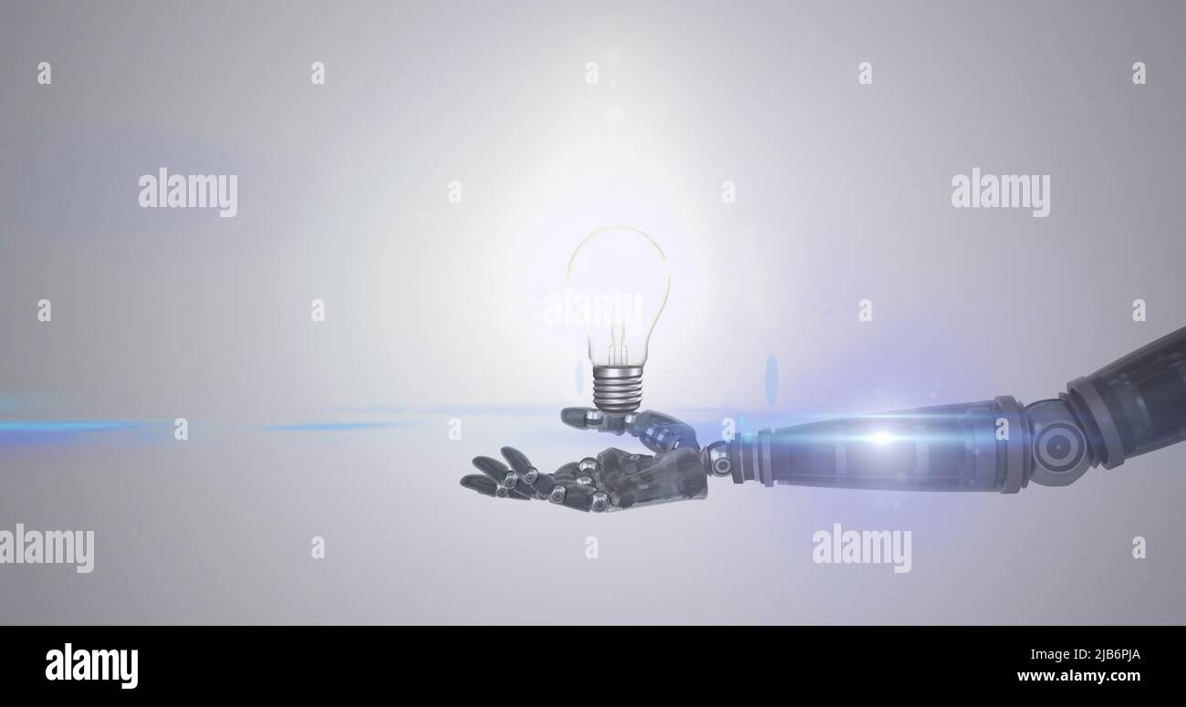 Image of illuminated light bulb over hand of robot arm, with moving ...