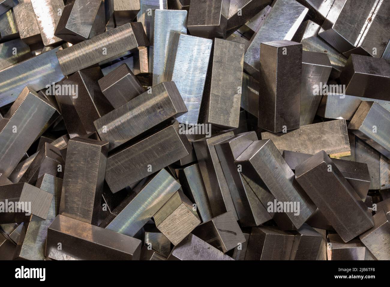 pile of cuboid steel workpieces after surface grinding Stock Photo - Alamy