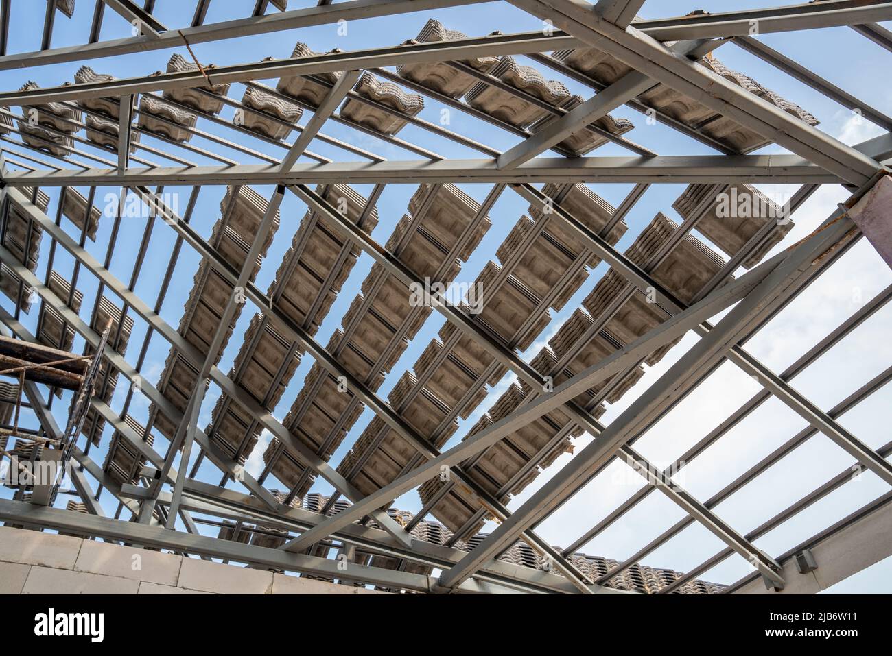 Concrete or CPAC cement roof tiles on the new roof structure. under ...