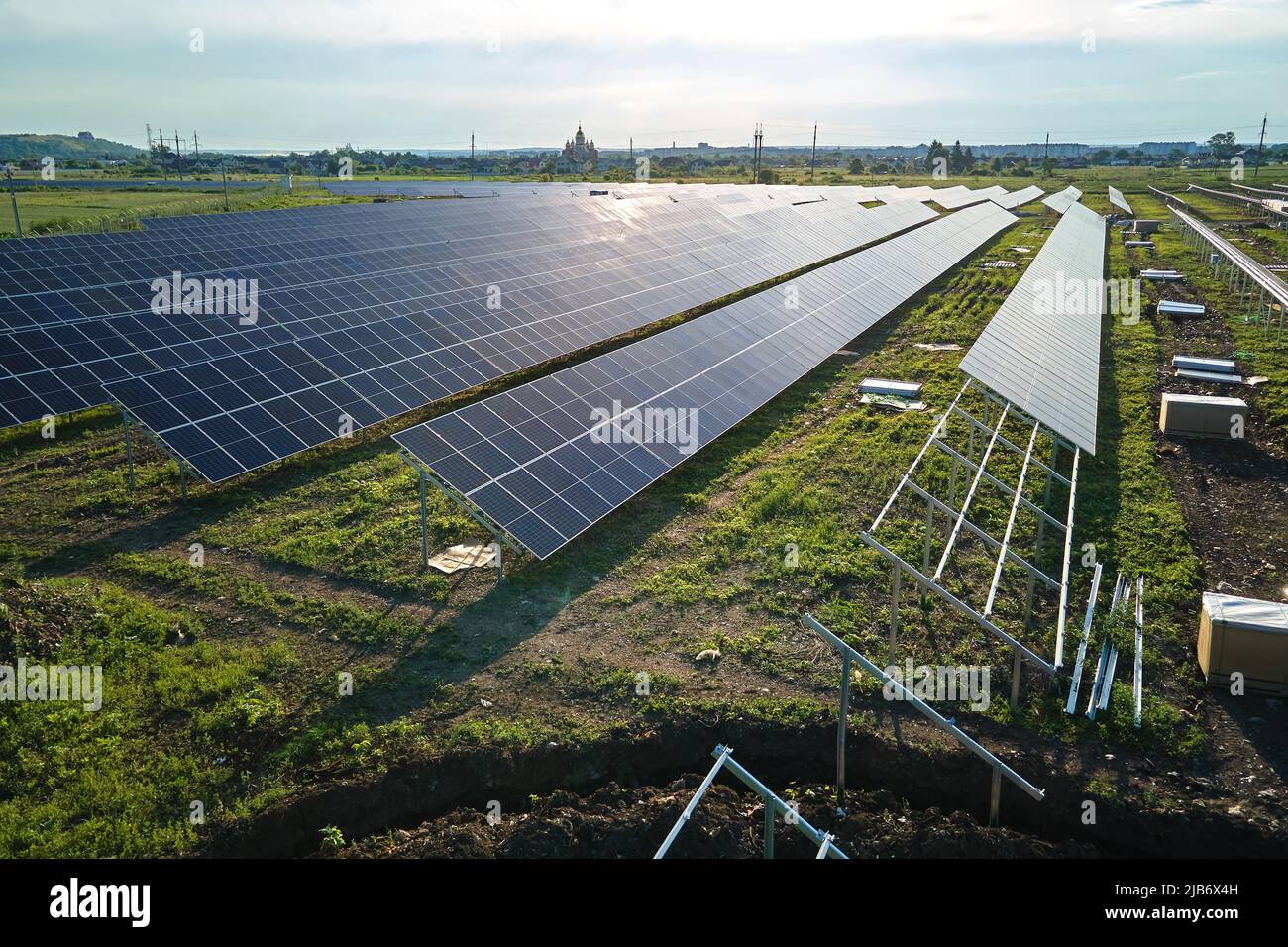 Aerial view of big electric power plant under construction with many ...
