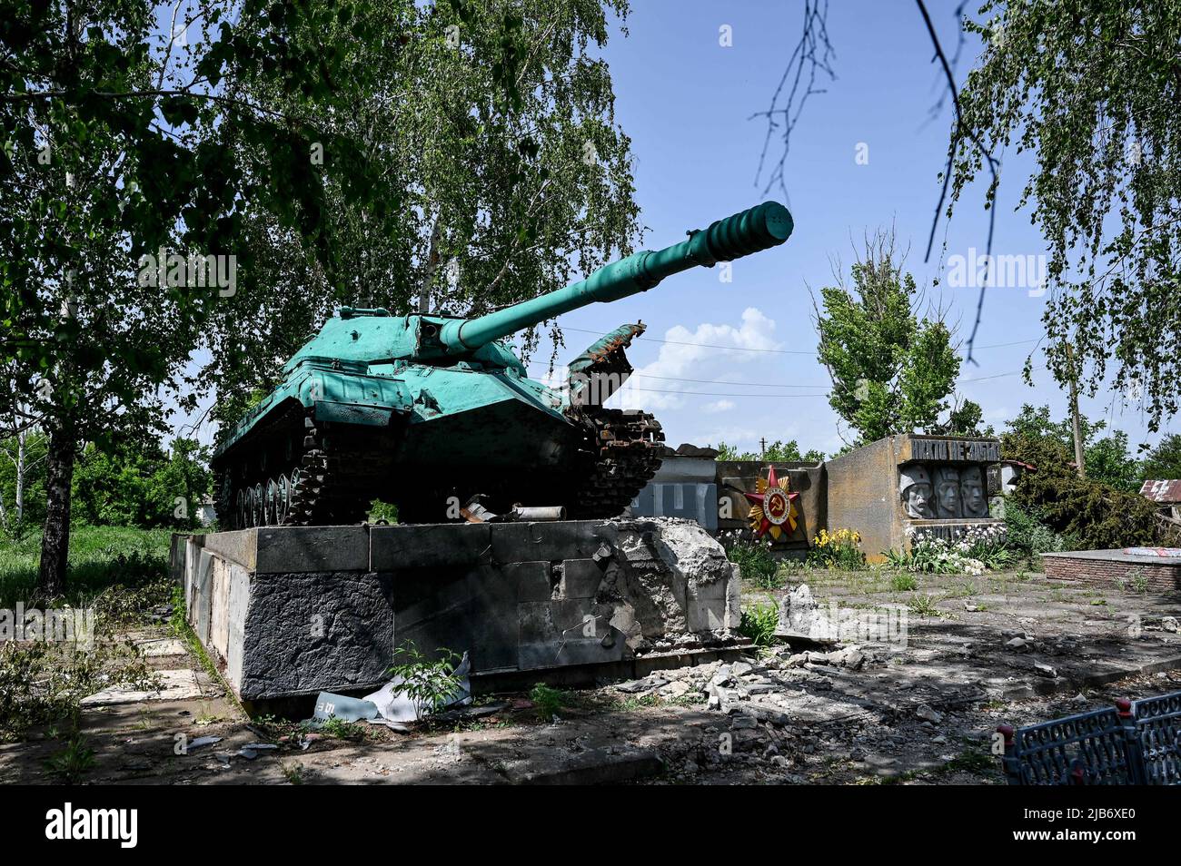 An AFU soldier is seen next to a World War II tank damaged as a result ...
