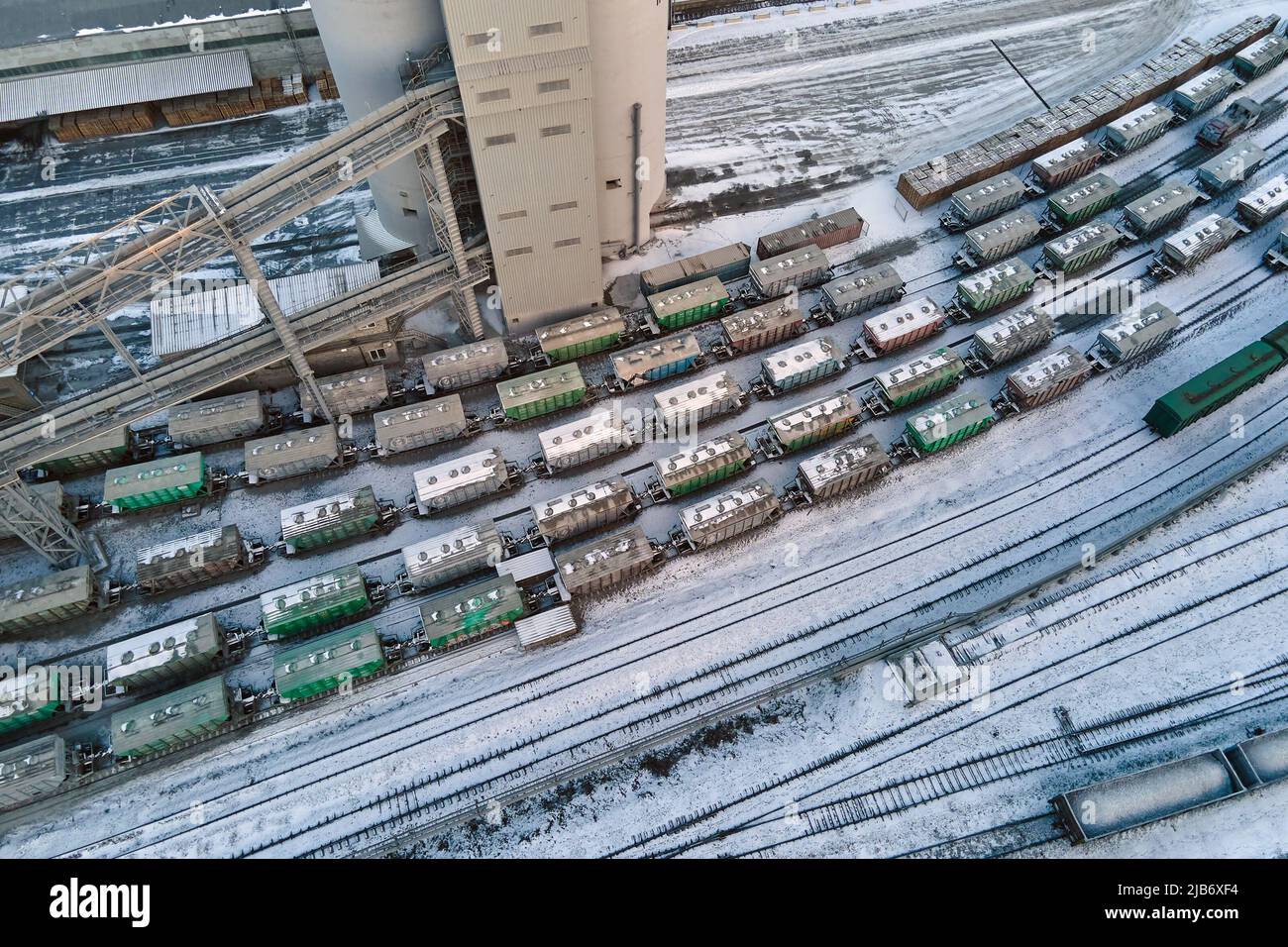 Aerial view of cargo train cars loaded with construction goods at ...