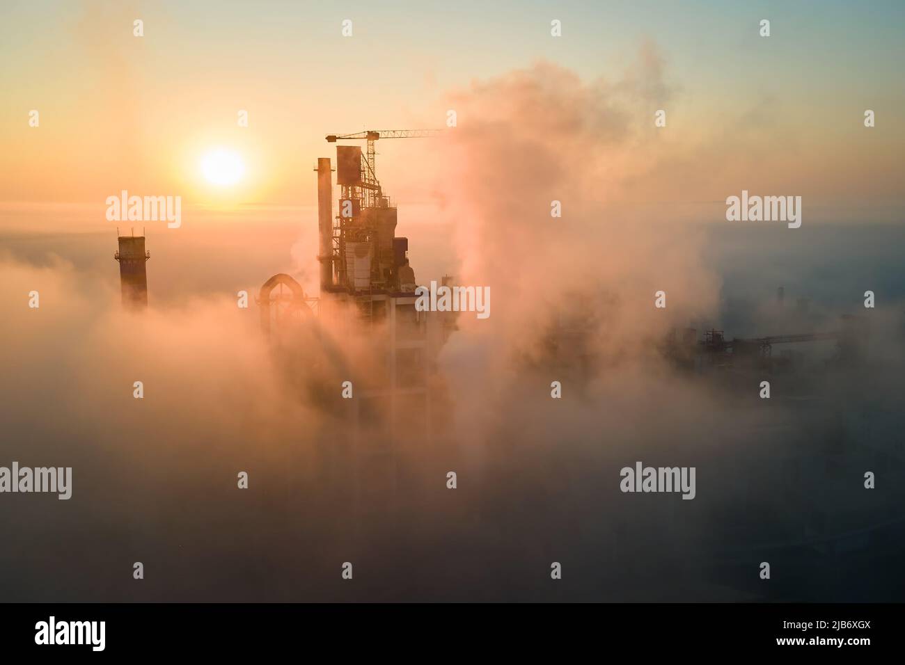 Aerial view of cement factory with high concrete plant structure and ...