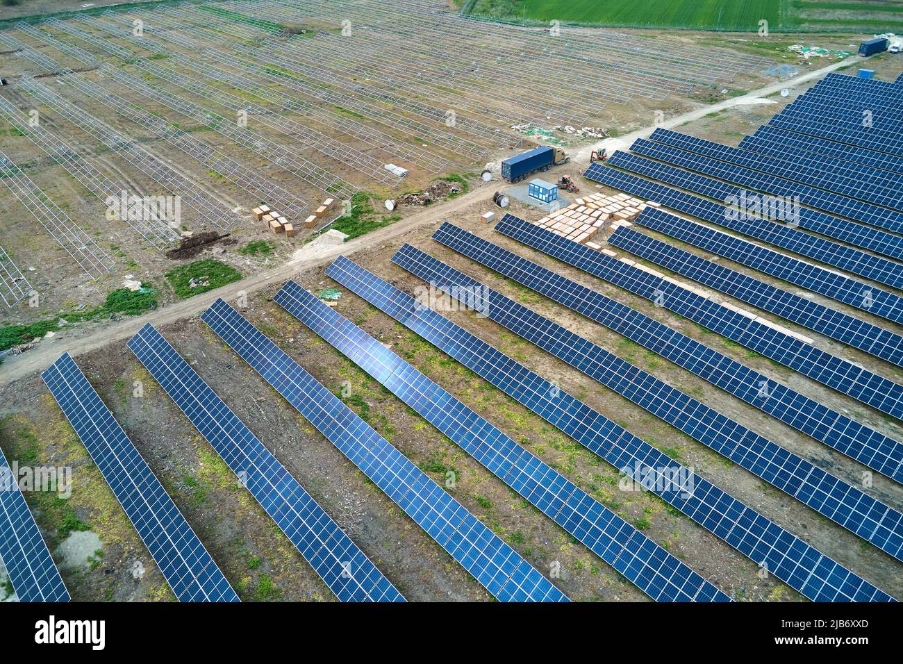 Aerial view of electrical power plant under construction with truck ...