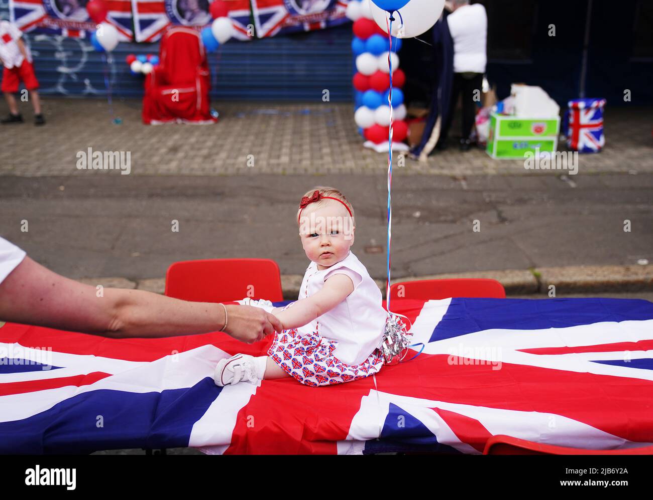 Nine month old Jessica Berryman attends a street party on Donegal Pass ...