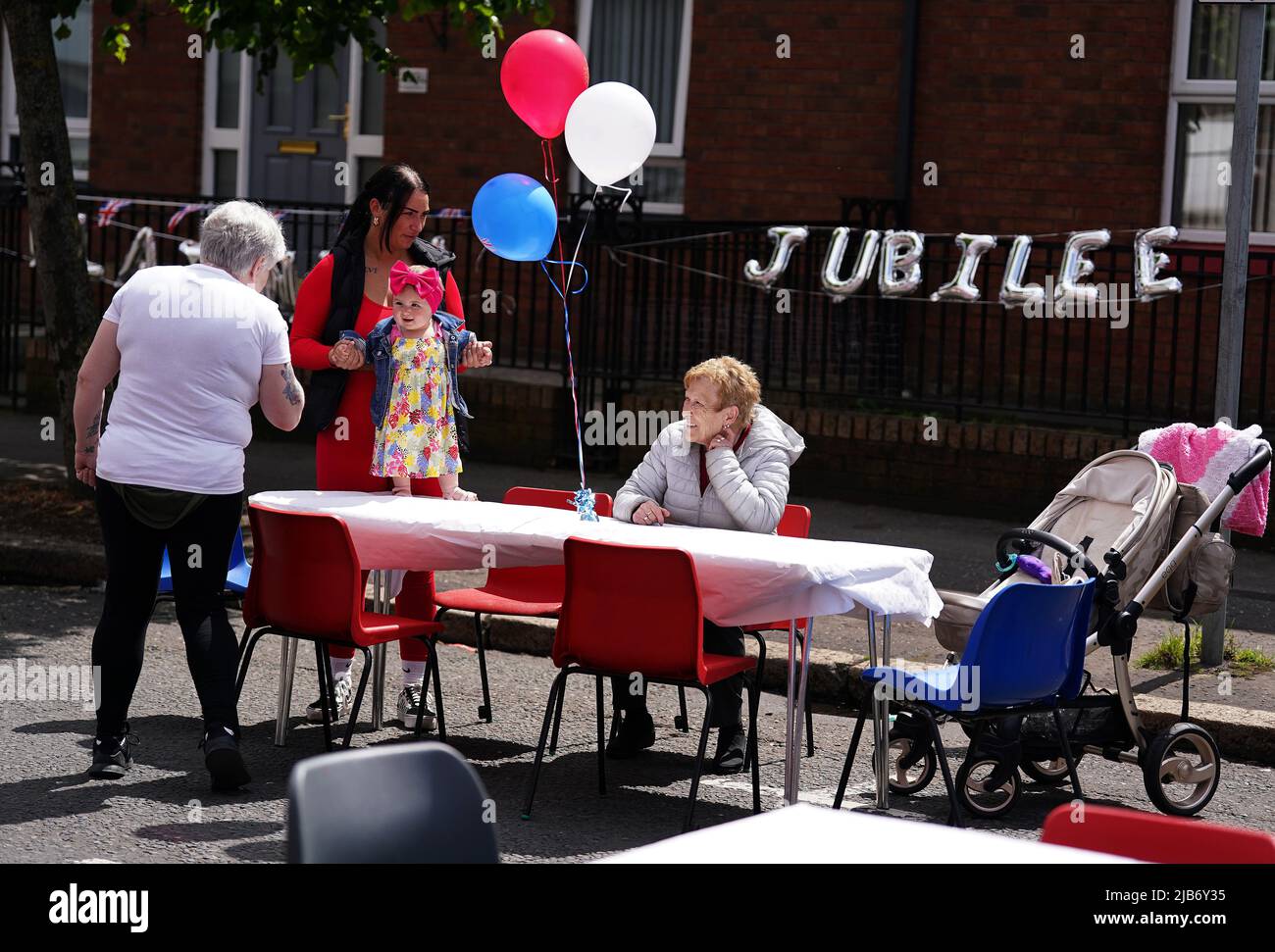 People attend a street party on Donegal Pass in Belfast city centre as ...