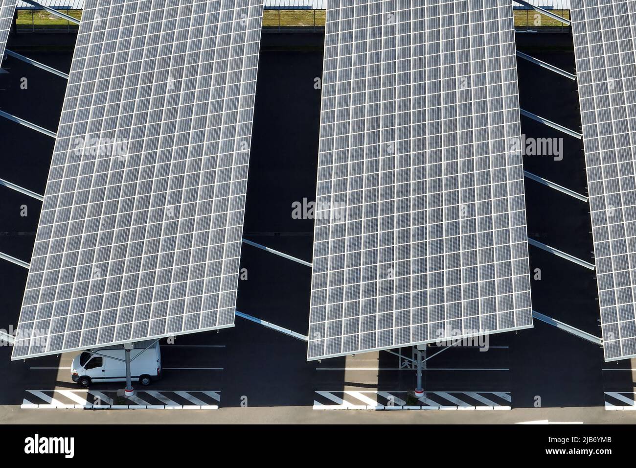 Aerial view of solar panels installed as shade roof over parking lot ...