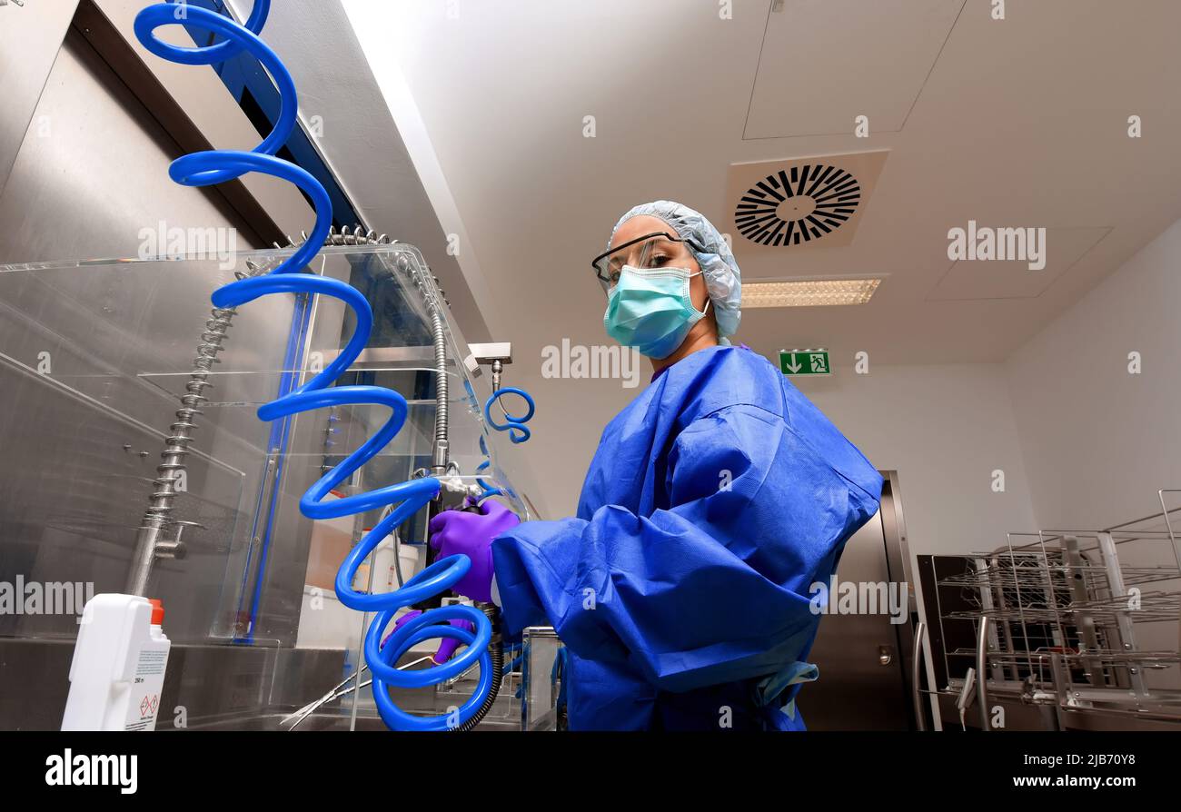 A girl works in a hospital as a medical hygiene worker. Dressed in ...