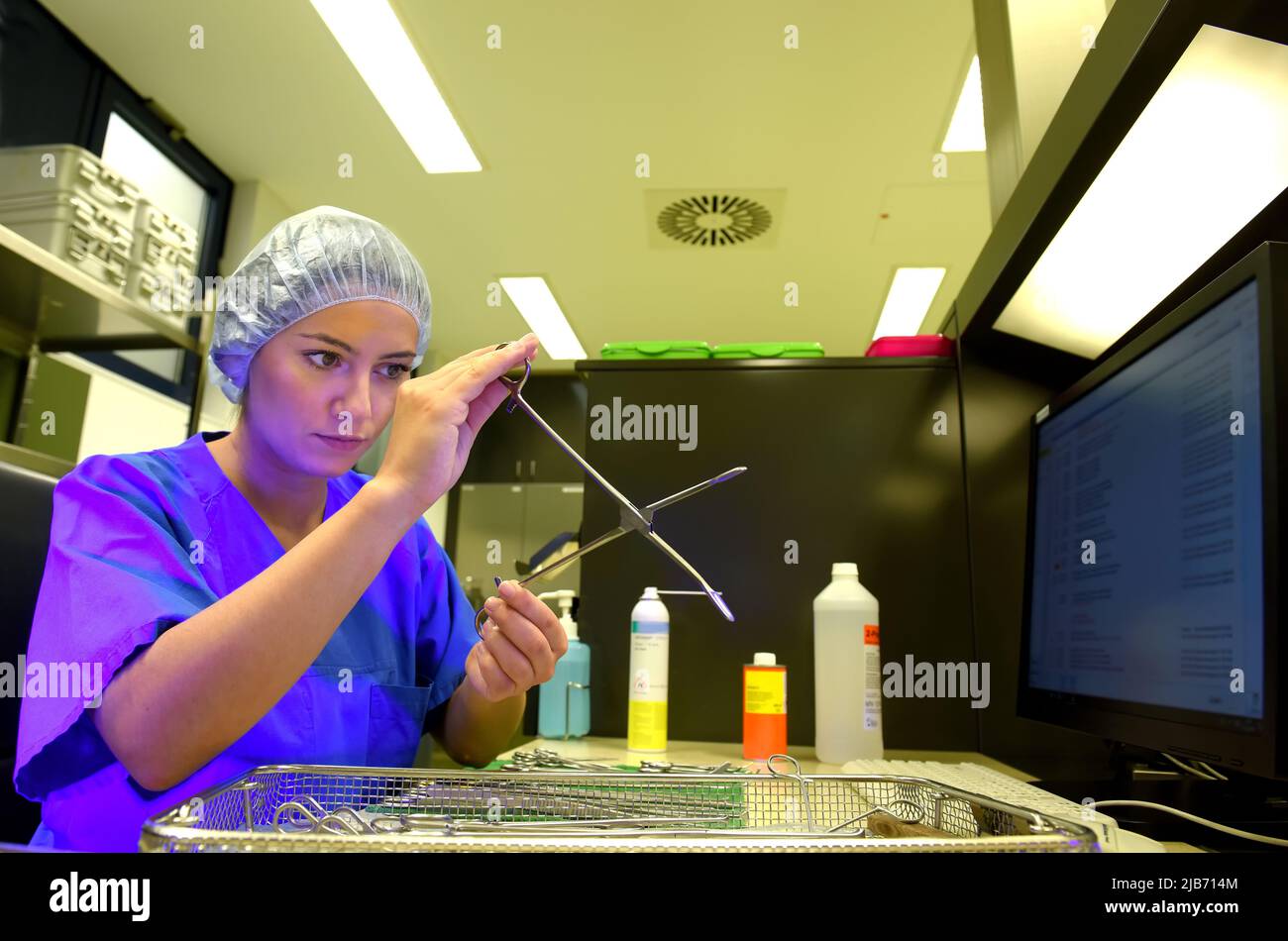 A girl works in a hospital as a medical hygiene worker. Dressed in ...