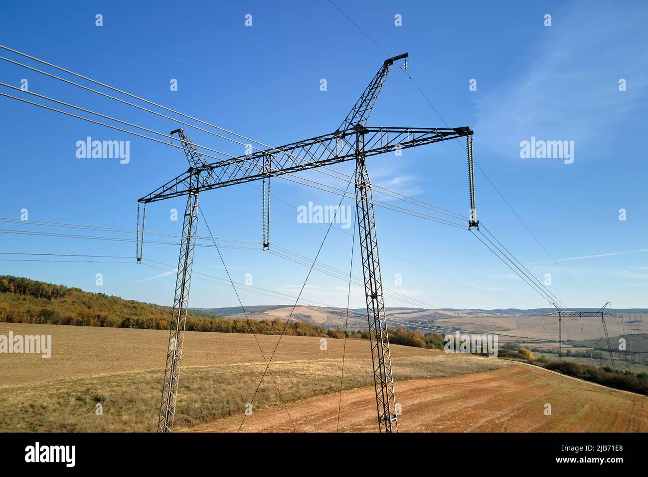 High voltage tower with electric power lines transfening electrical ...