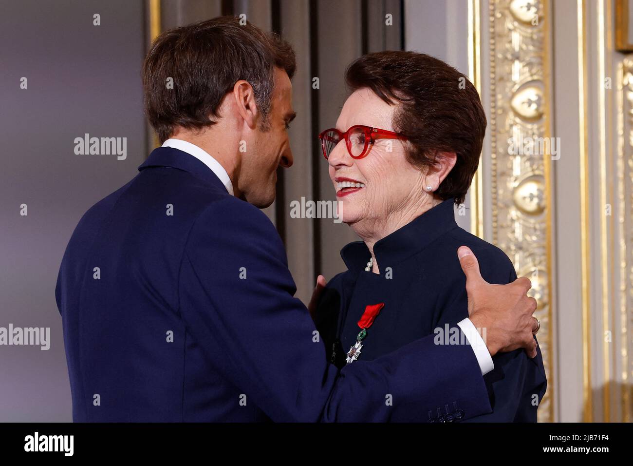 French President Emmanuel Macron hugs tennis legend Billie Jean King ...