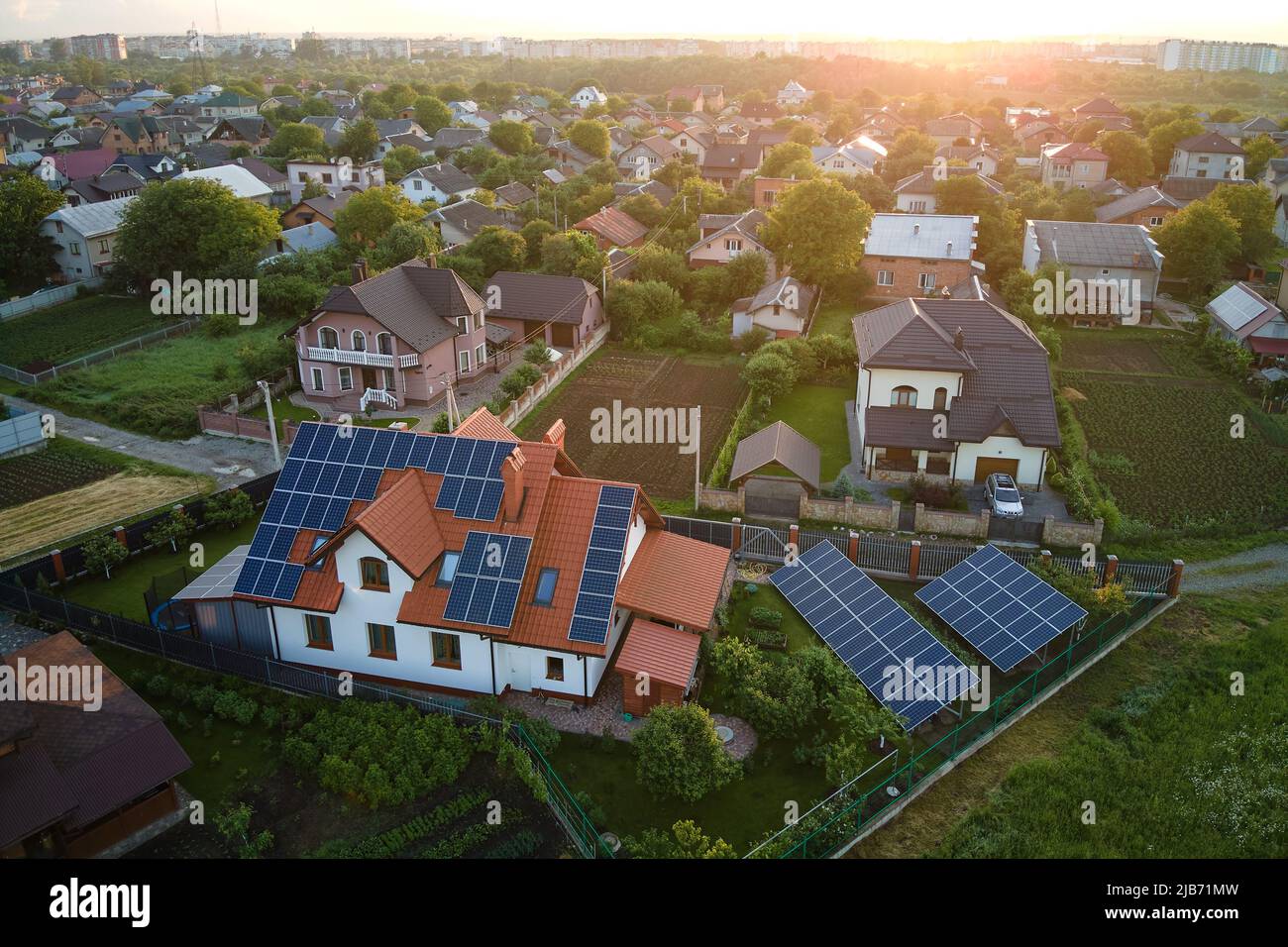 Residential house with rooftop covered with solar photovoltaic panels ...