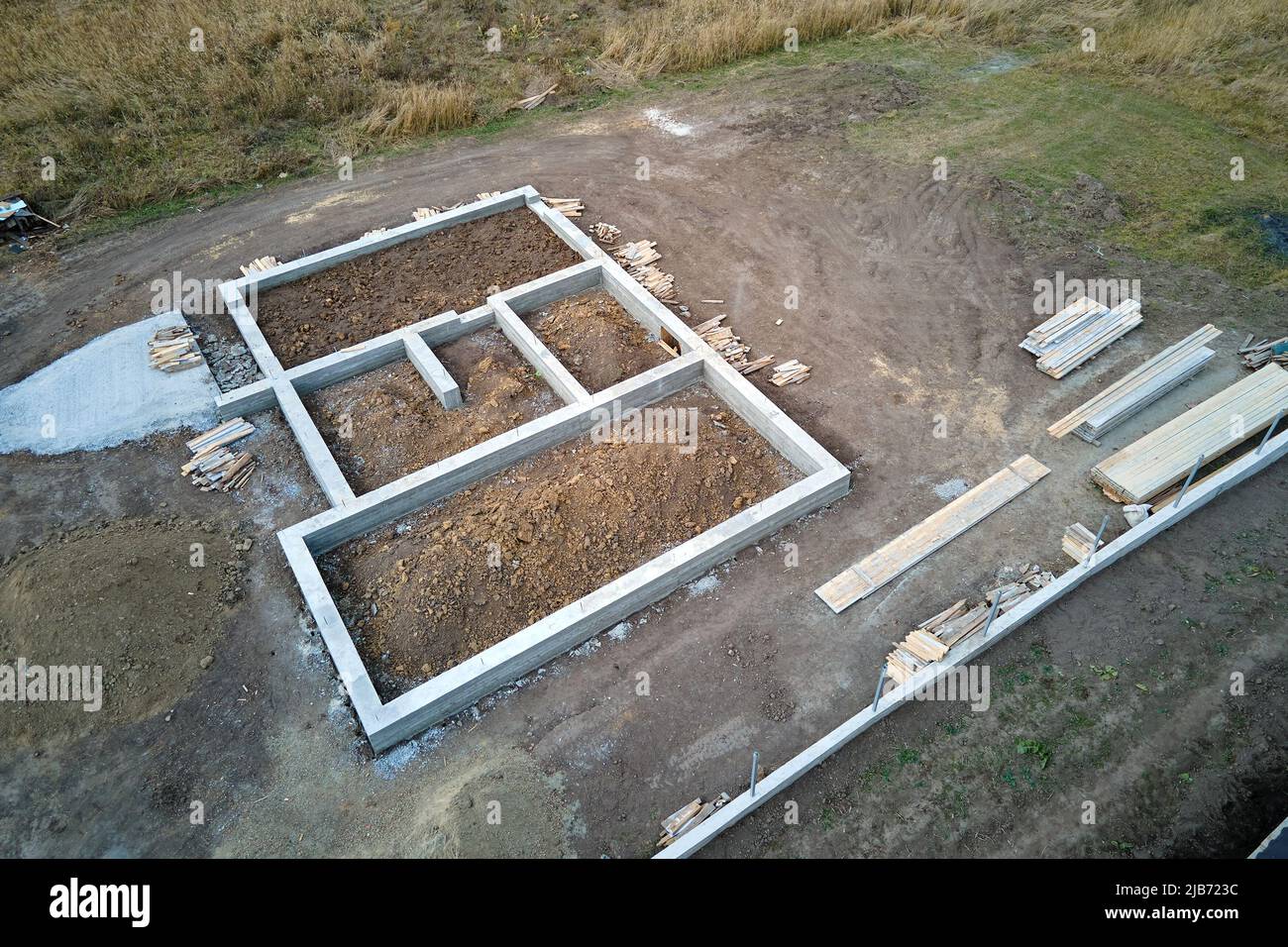 Top down aerial view of building works of new house concrete foundation ...