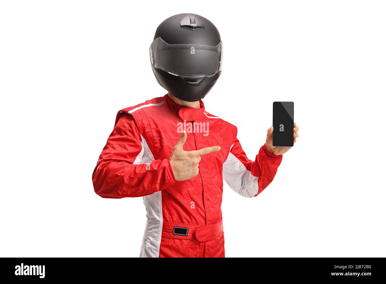 Motorsport racer with a helmet holding a smartphone and pointing ...