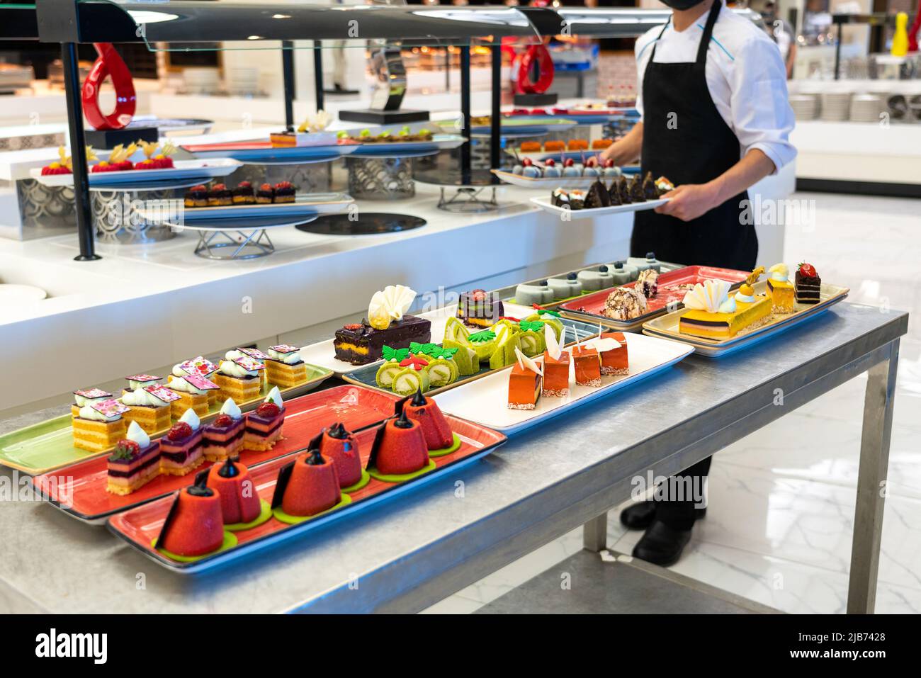 Photo sweet table pastries and cakes in the hotel bar with staff Stock ...