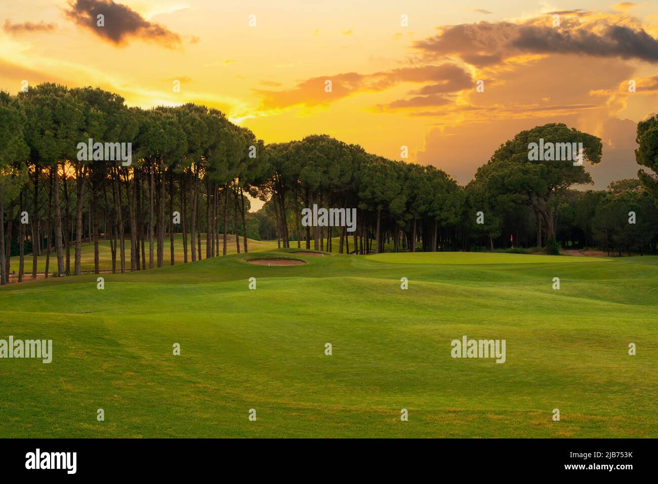 Golf course at sunset with beautiful dramatic sky. Scenic panoramic ...