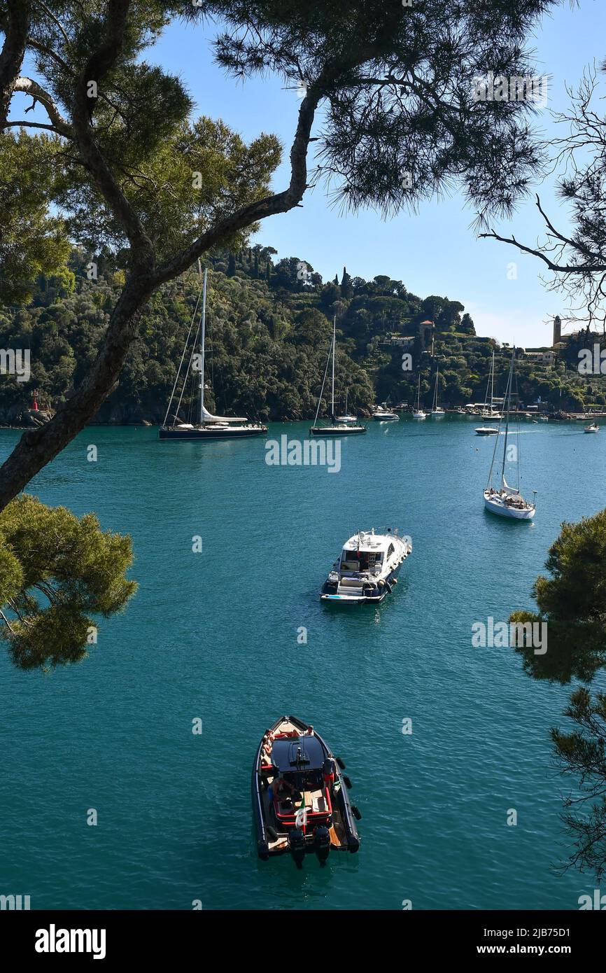 Baia Cannone bay with people sunbathing on anchored boats and the ...