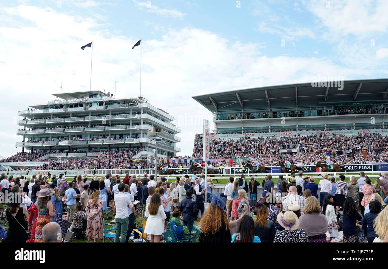Racegoers watch the Poundland Surrey Stakes on Ladies Day during the ...