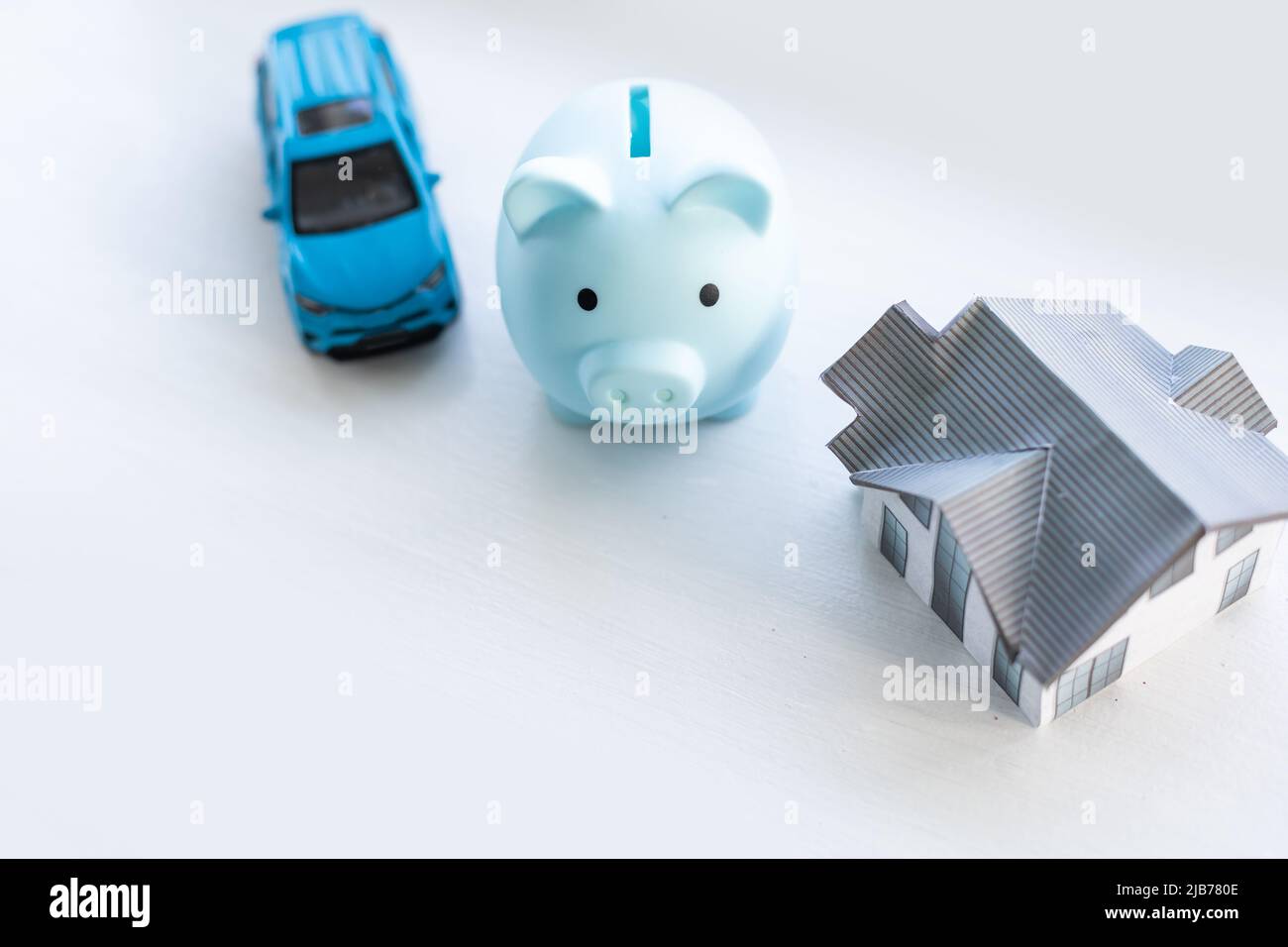 pig piggy bank, toy car, house Stock Photo - Alamy