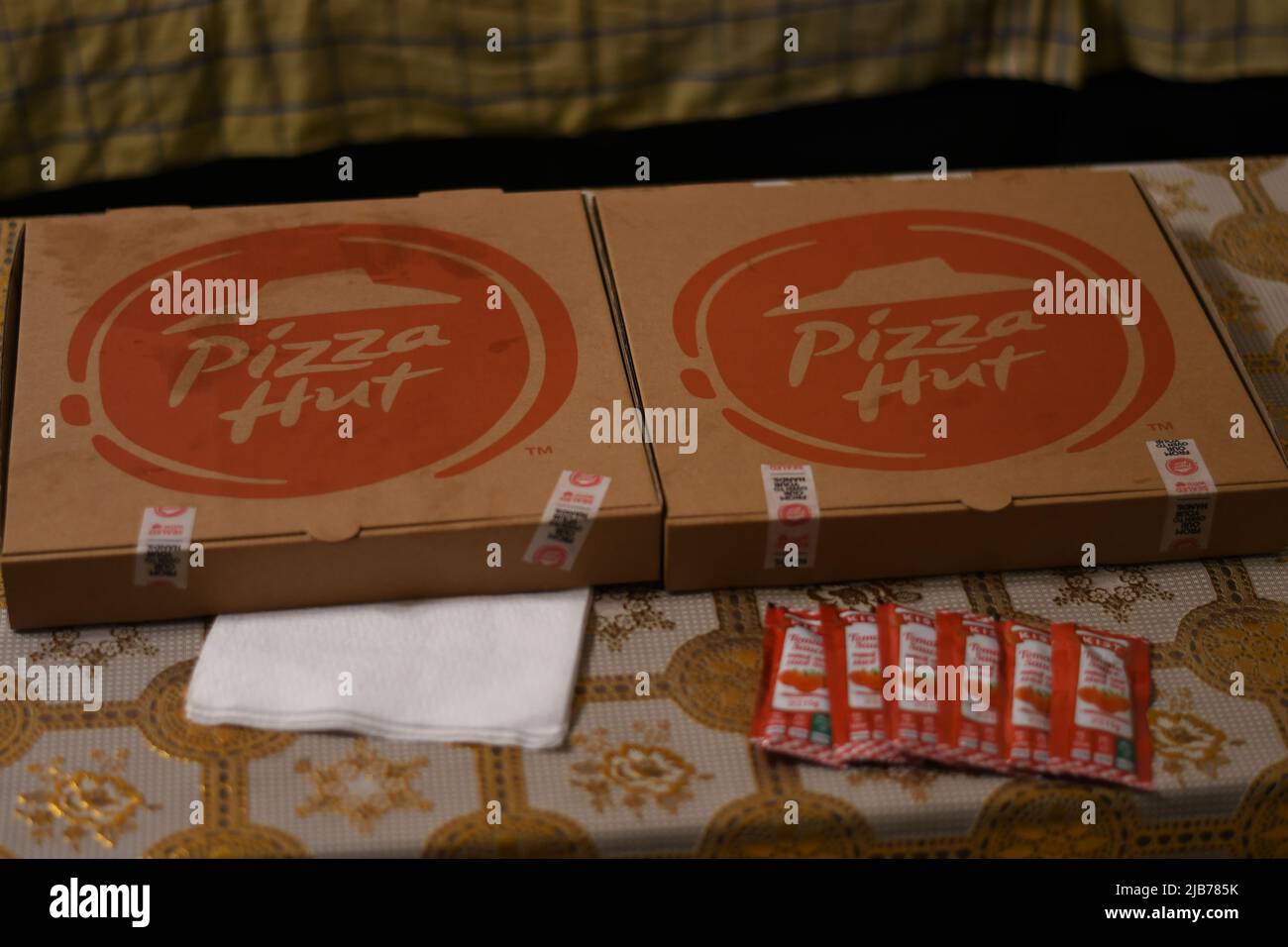 Two packed pizzas on a table Stock Photo - Alamy