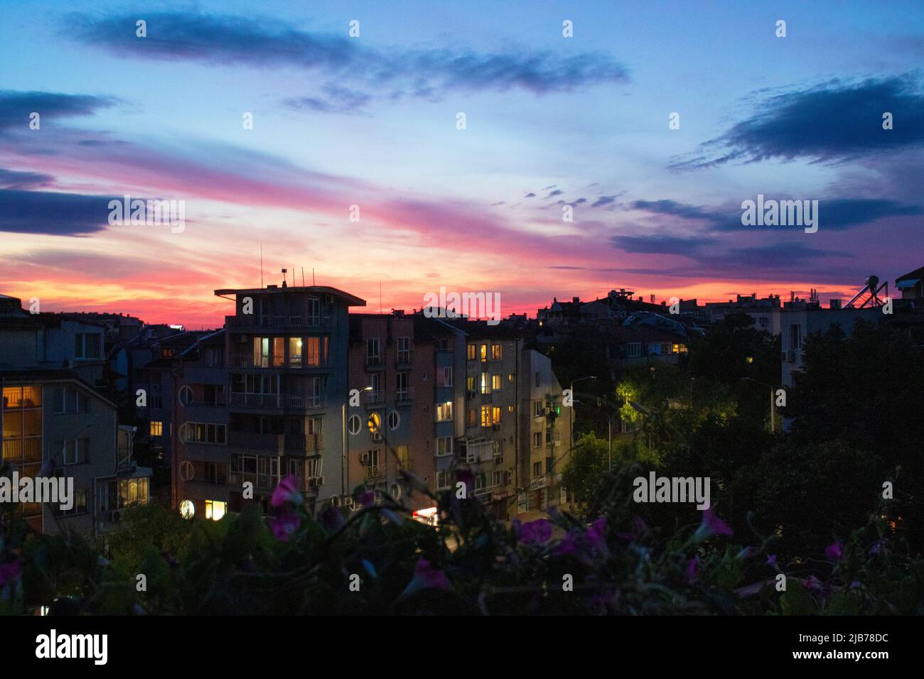 Colorful skies over Residential district of Varna city at night ...