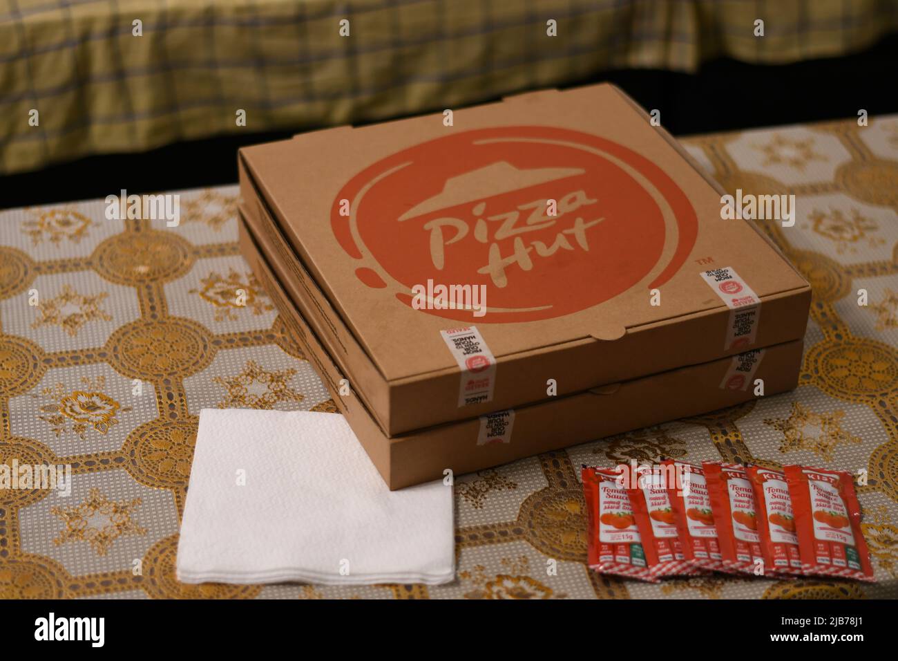 Two packed pizzas on a table Stock Photo - Alamy