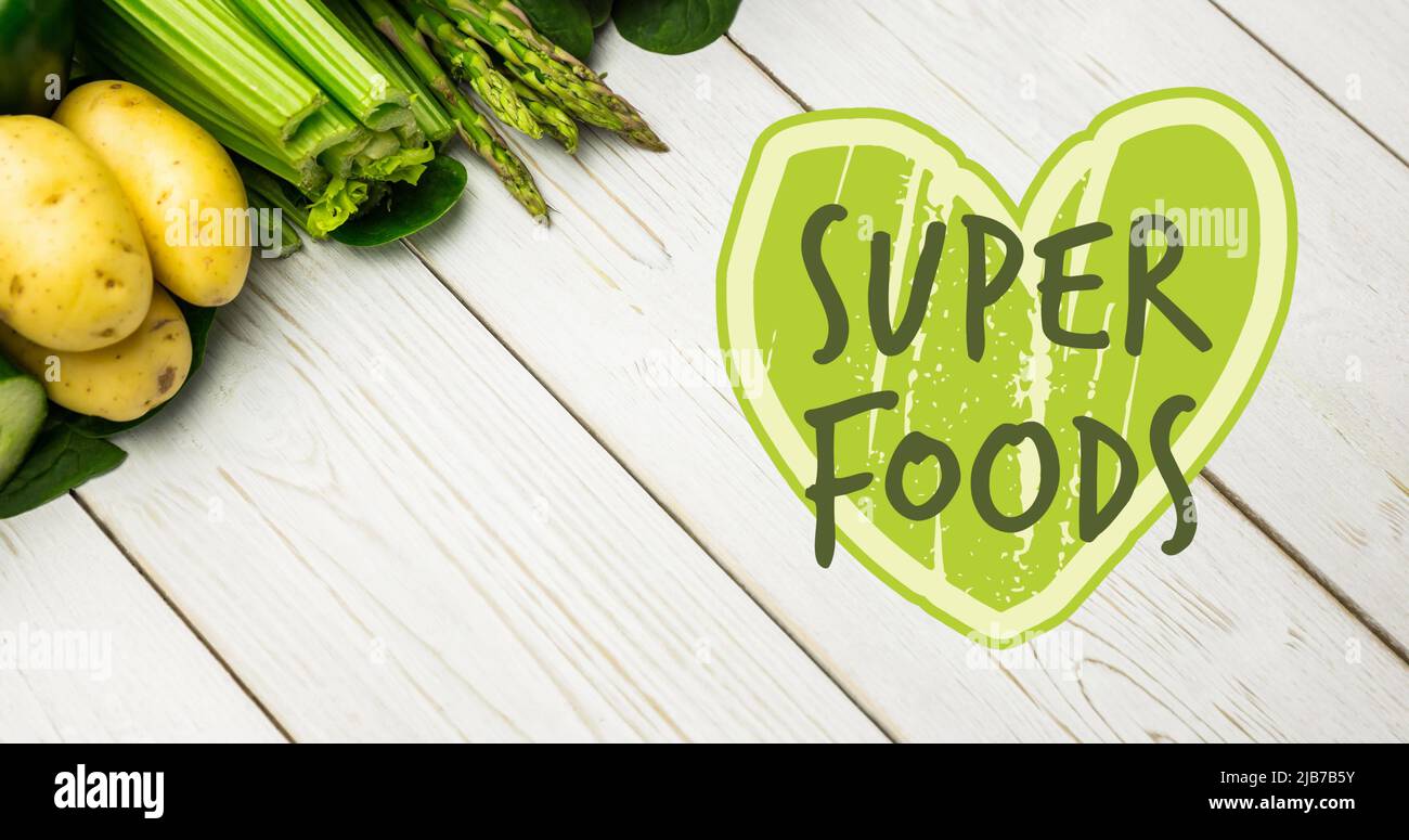 Image of super foods text in green over fresh organic vegetables on ...
