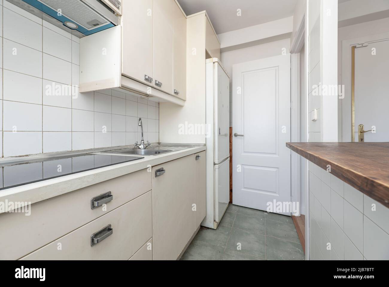 kitchen front with white cabinets and matching drawers with wood ...