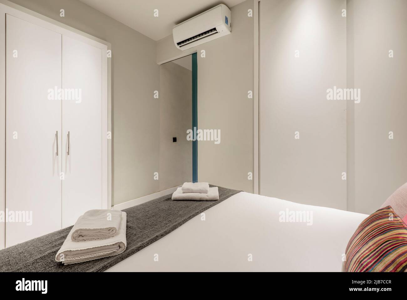 Bedroom with a double bed with fitted wardrobes with sliding doors, an ...