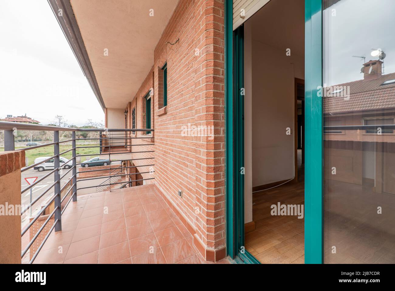 terrace of a house with green aluminum and glass sliding windows in a ...