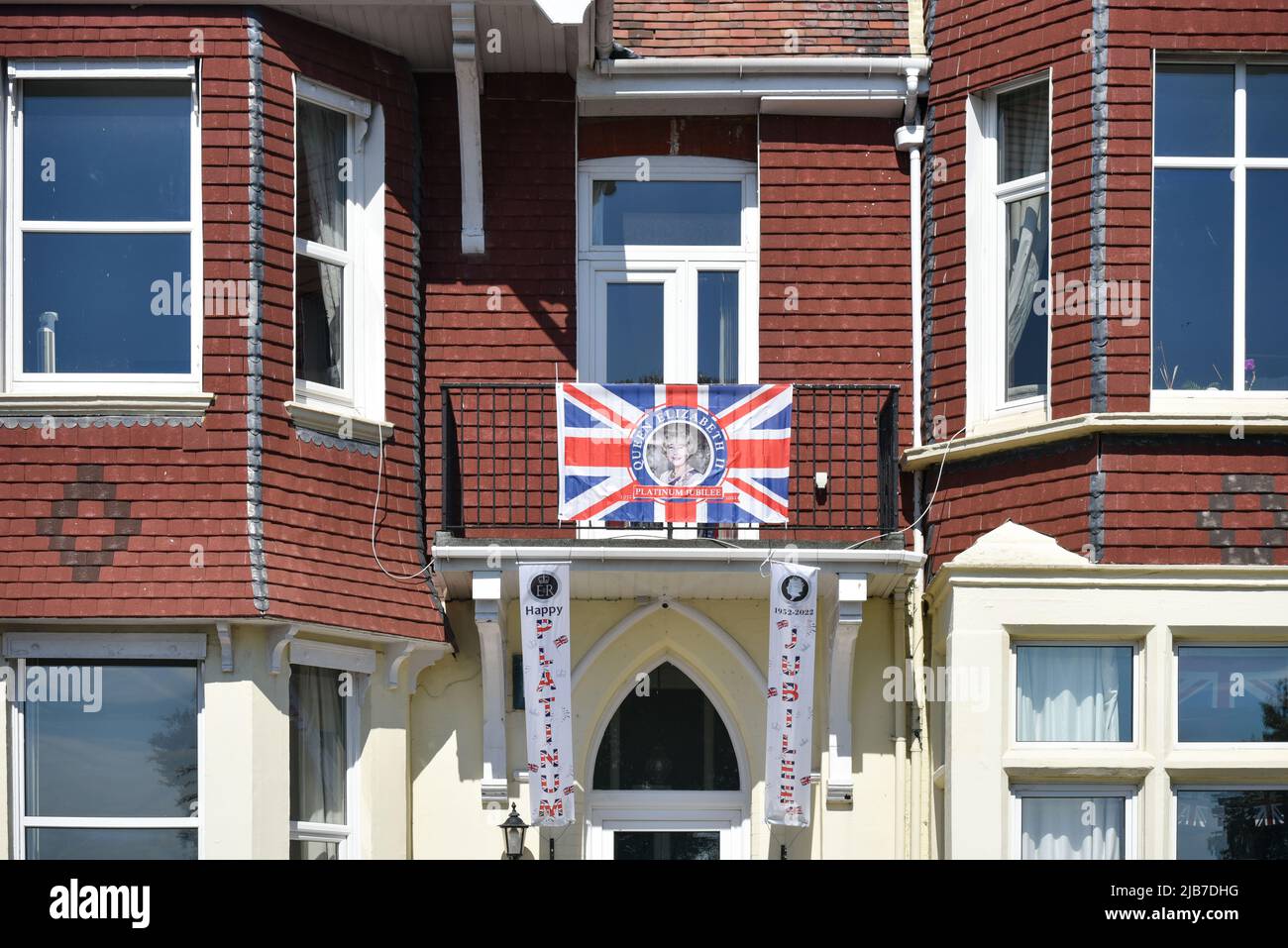 English building with flag and banners to celebrate the Platinum ...