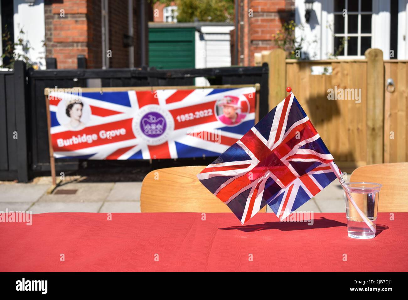 2022. Union Jack flag and a banner celebrating the Queens Platinum ...