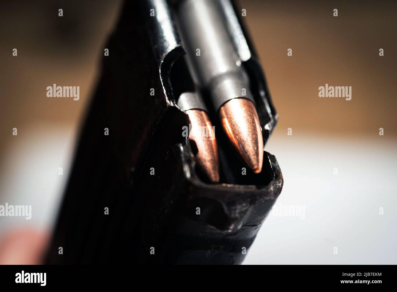 An AK-47 style assault rifle 30-round magazine is loaded with 7.62 x 39 ...