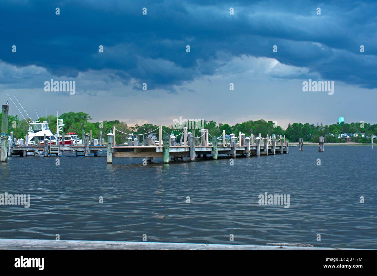 A storm with dramatic skies approaches the Keyport Marina and Harbor on ...