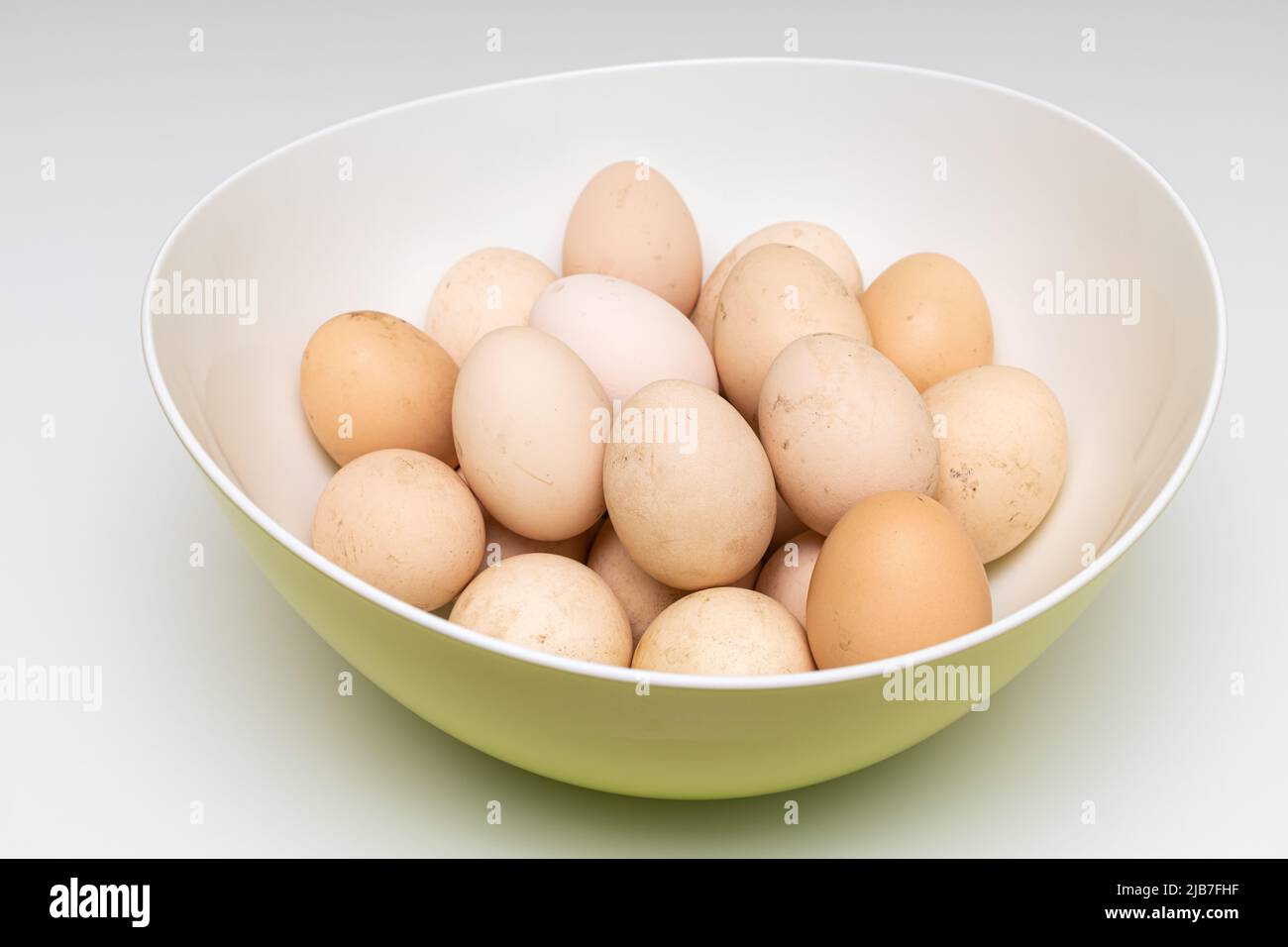 fresh unwashed rustic eggs lie in a deep bowl Stock Photo - Alamy