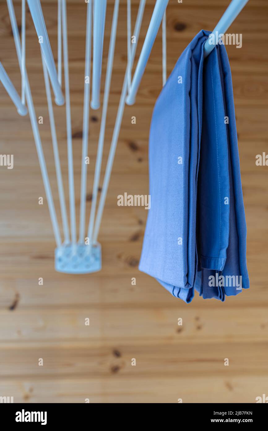 clothes dryer attached to the ceiling with clothes hanging Stock Photo ...