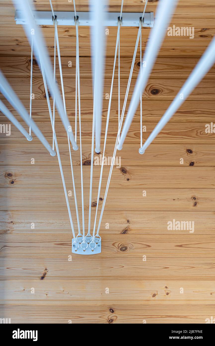 clothes dryer attached to the ceiling with clothes hanging Stock Photo ...