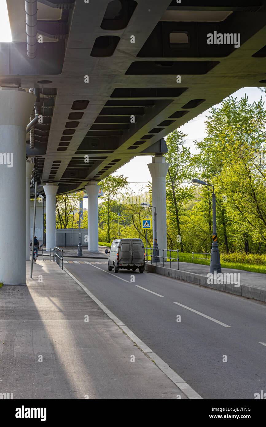 Moscow, Russia - May 21, 2022: an empty road passing under an elevated ...
