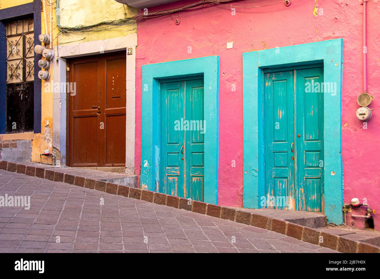 Pink house houses building buildings structure structures cobblestone ...