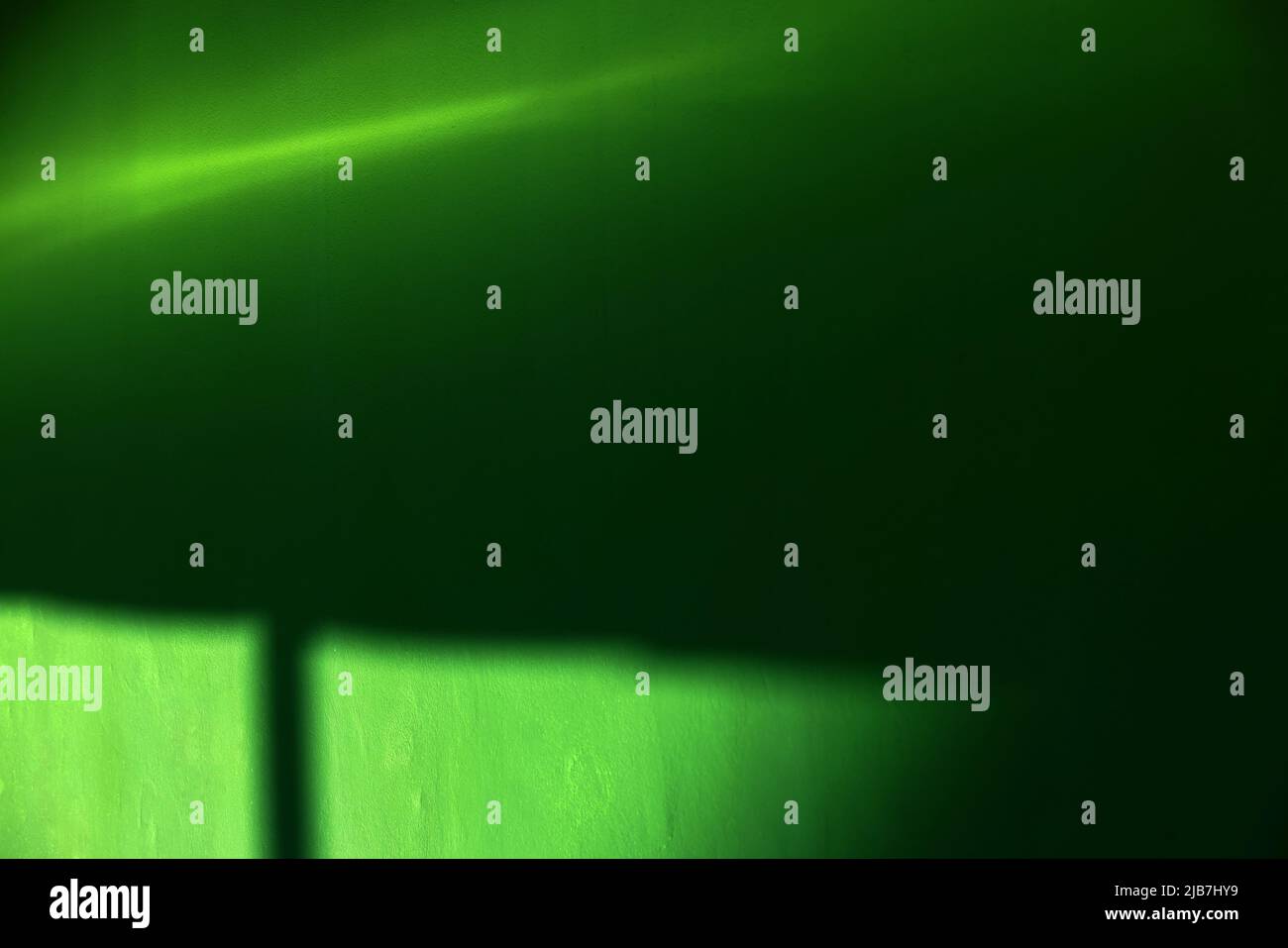 Abstract ray of light against a painted wall background Stock Photo - Alamy