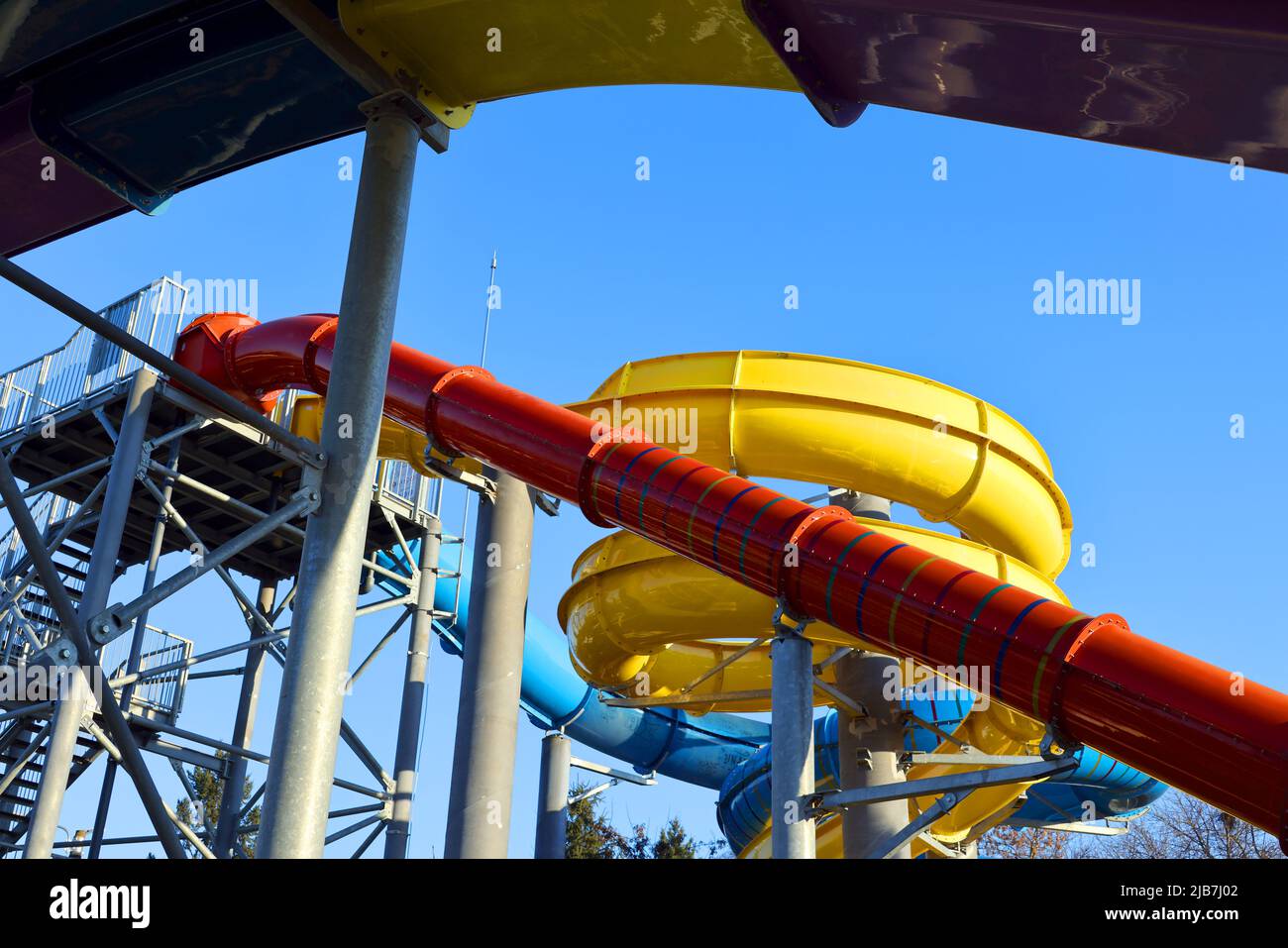 Image of colourful aquapark sliders during winter Stock Photo - Alamy