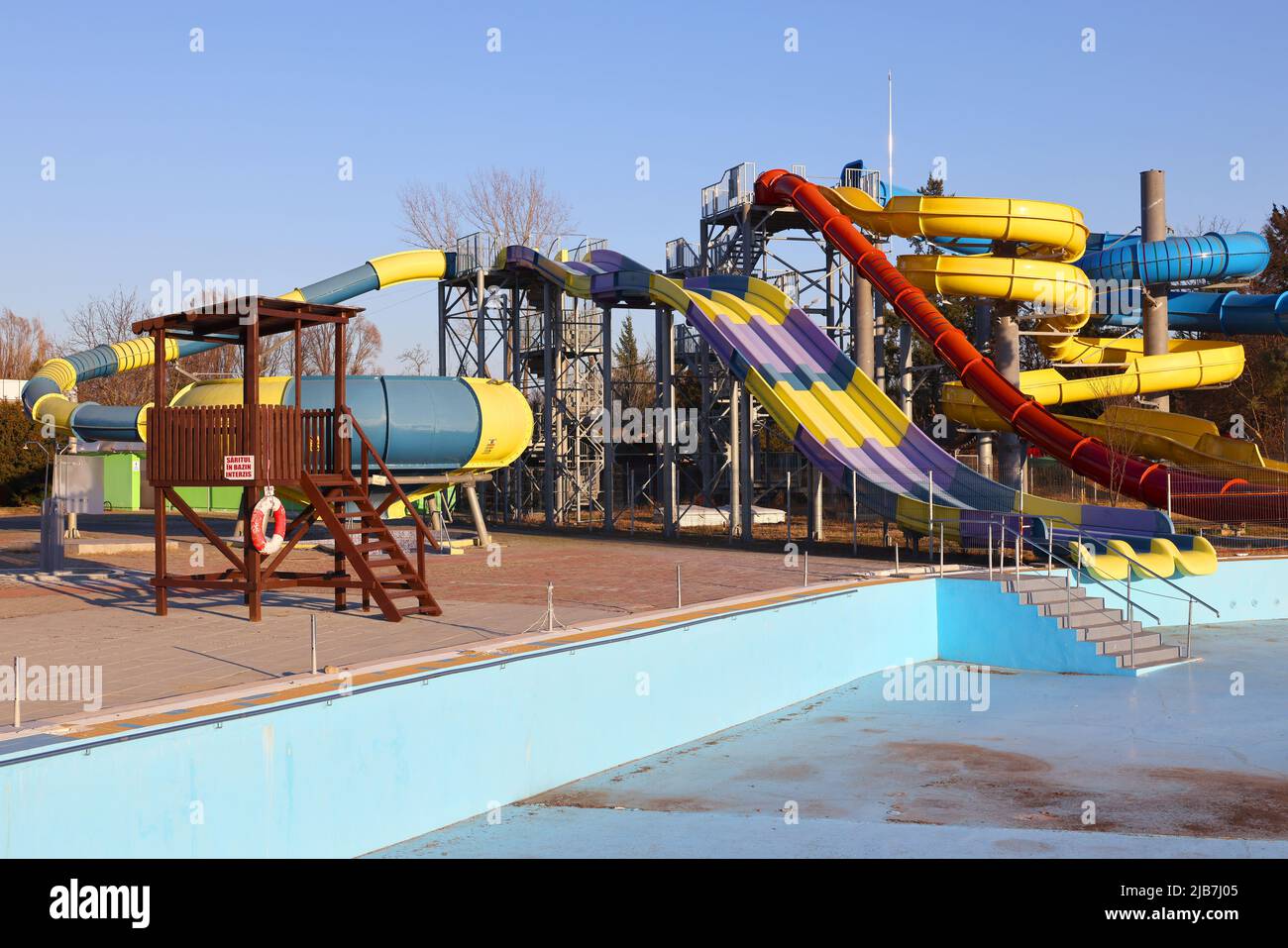 Image of colourful aquapark sliders during winter Stock Photo - Alamy