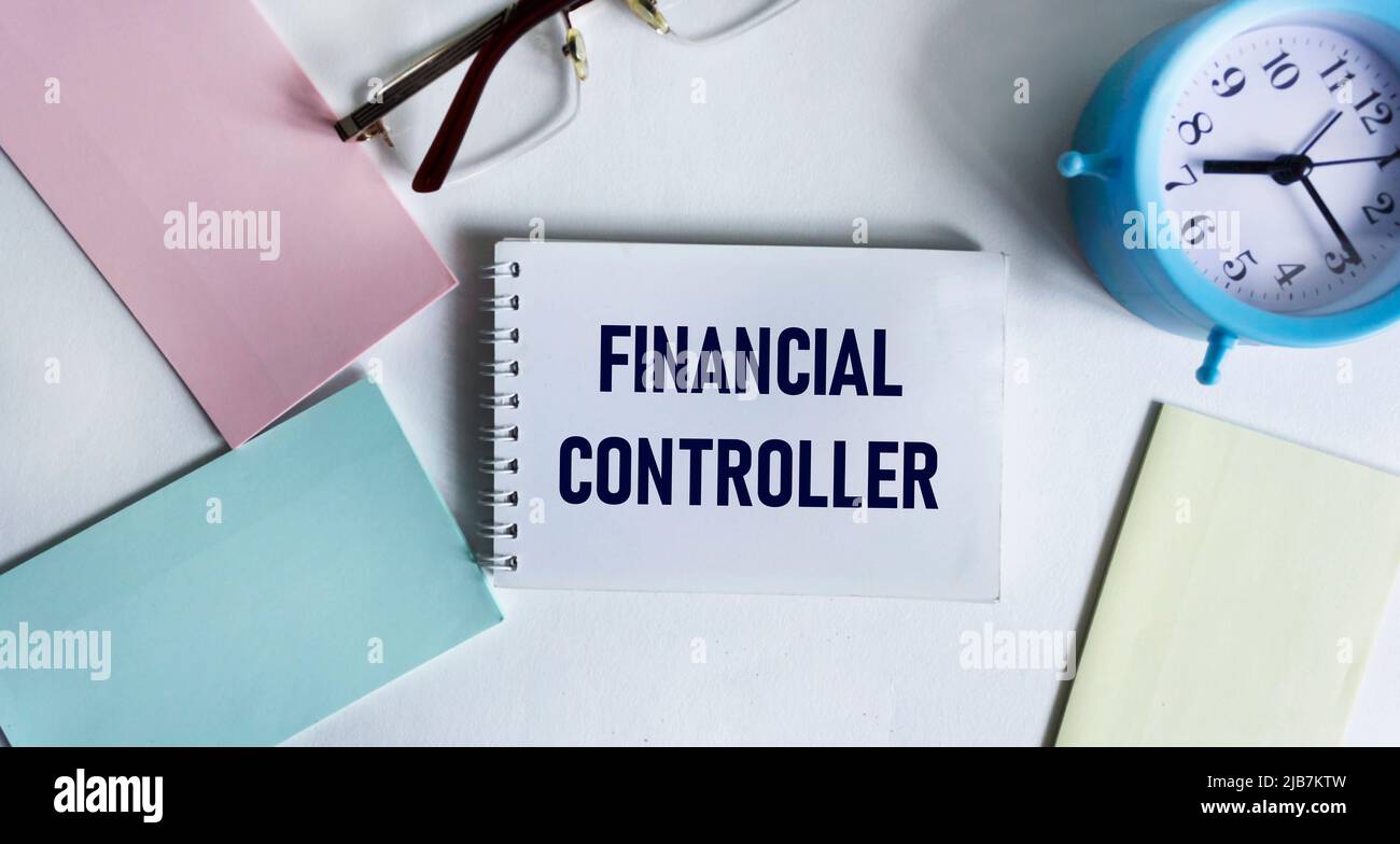 text FINANCIAL CONTROL written on a notepad and a white background with ...